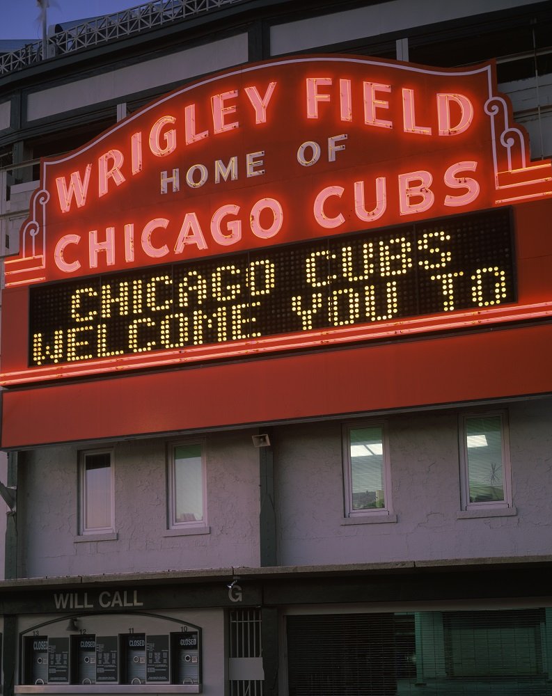Neon sign of a baseball stadium lit up at dusk, Wrigley Field, Chicago