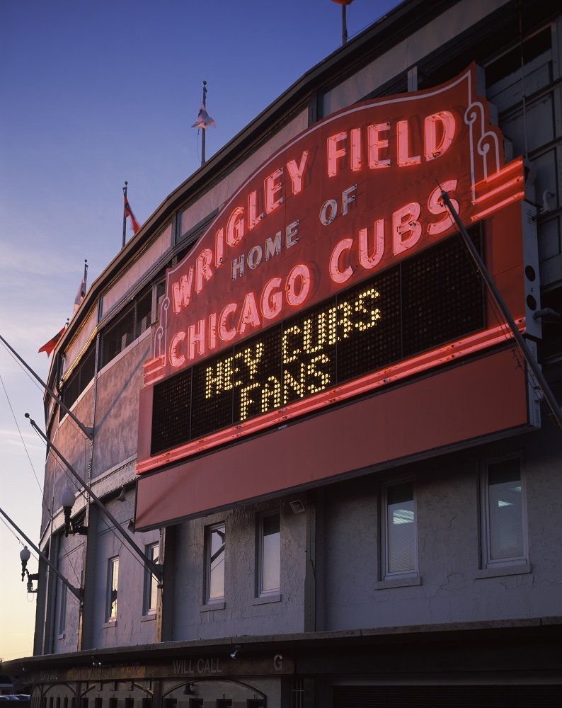 Neon sign of a baseball stadium lit up at dusk, Wrigley Field, Chicago